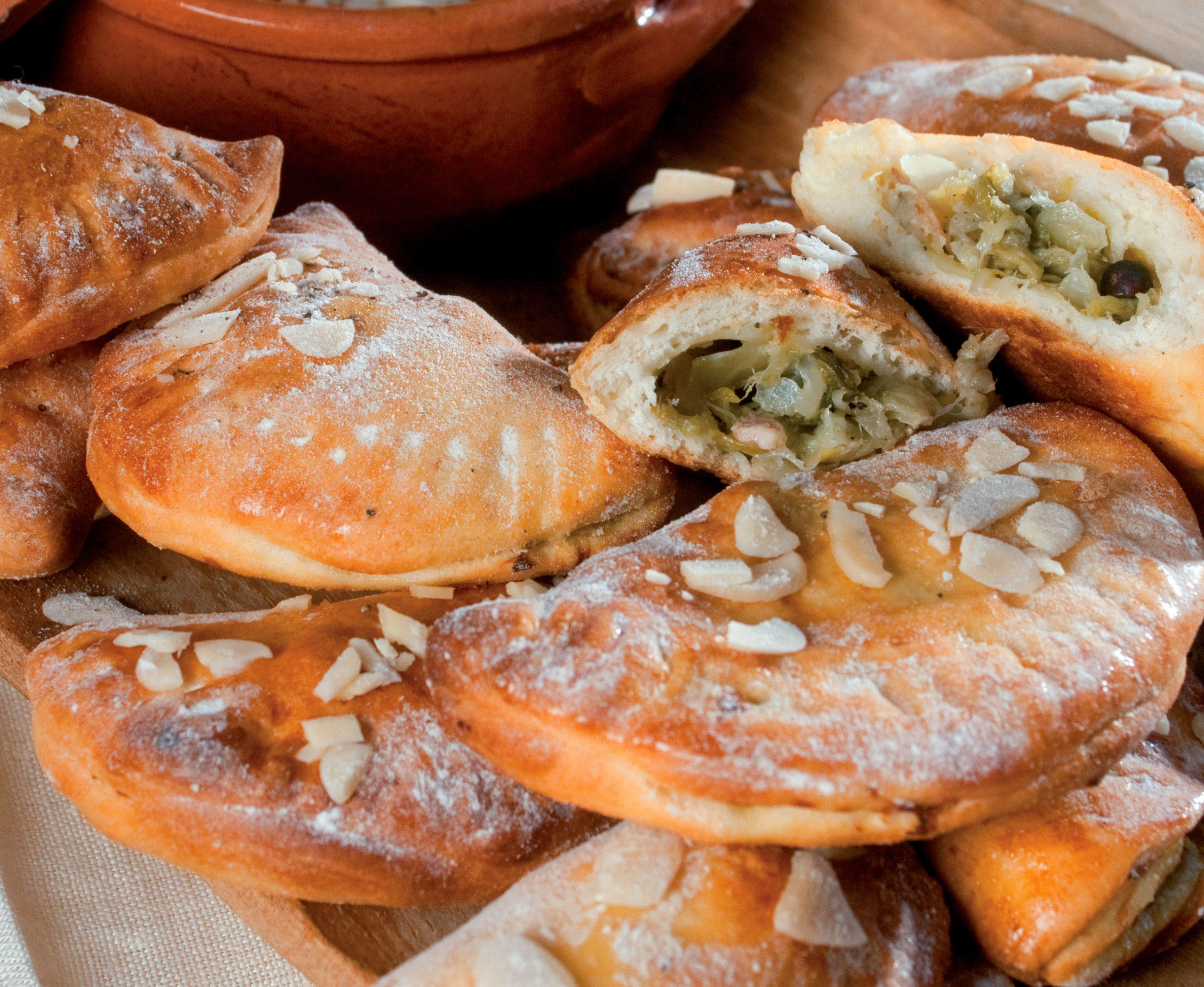 Mezzelune with cabbage, speck and fontina cream